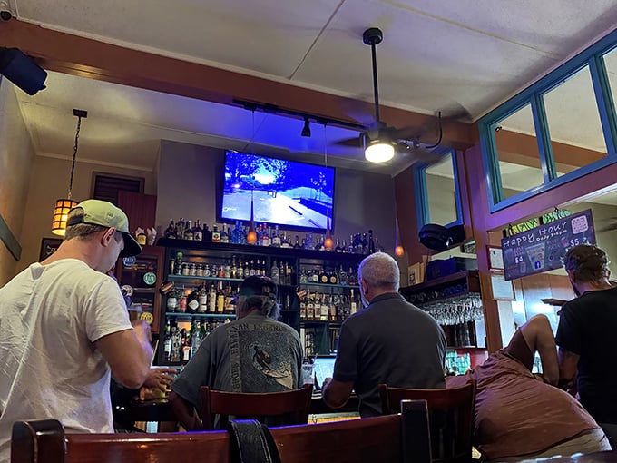 The bar area &ndash; where local brews flow as freely as the stories exchanged between visitors and kama'aina alike.