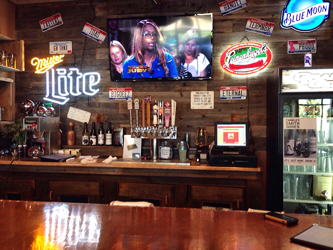 The bar area, where cold beer flows freely to extinguish the pleasant heat of spicy BBQ sauce—a necessary service in the pursuit of flavor.