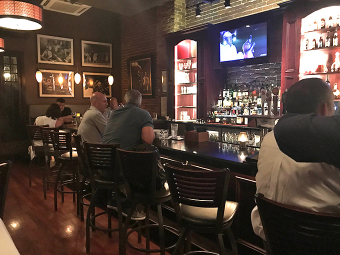 The bar area&mdash;where strangers become friends over perfectly mixed cocktails and shared appreciation for the game on screen.