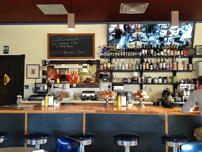The counter seats offer front-row tickets to the breakfast show, where coffee flows as freely as conversation.