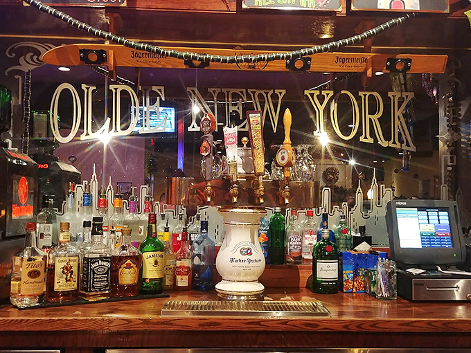 The bar's mirrored backdrop reflects more than bottles &ndash; it captures decades of toasts, celebrations, and the occasional drowning of sorrows in excellent beer.