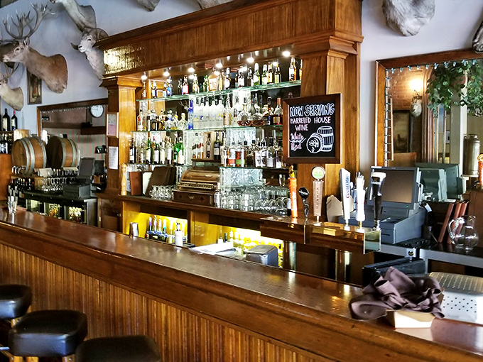 A bar that understands priorities &ndash; well-stocked shelves, polished wood, and enough space to settle in for serious conversations about life, love, and whether to order another round.