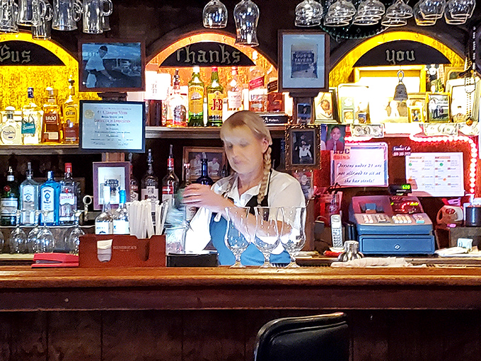 The bar's wooden arches frame bottles like precious artwork, promising libations worthy of pairing with that prime rib masterpiece.