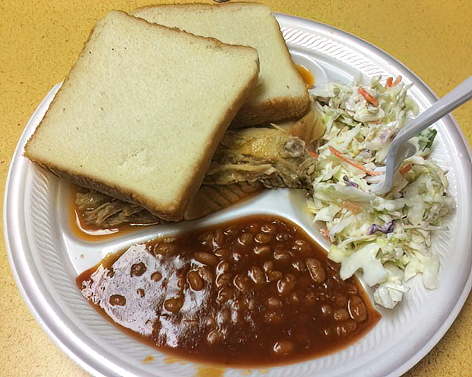 A proper Southern plate: meat, bread, slaw, and beans &ndash; four humble ingredients elevated to an art form through smoke and time.