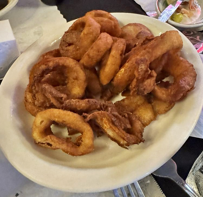 Onion rings the size of bracelets, with a golden-brown crunch that announces itself to everyone within earshot.