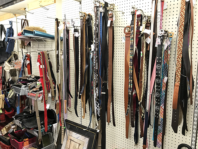 The belt display resembles a leather rainbow, offering options to hold up everything from dress slacks to dad jeans.