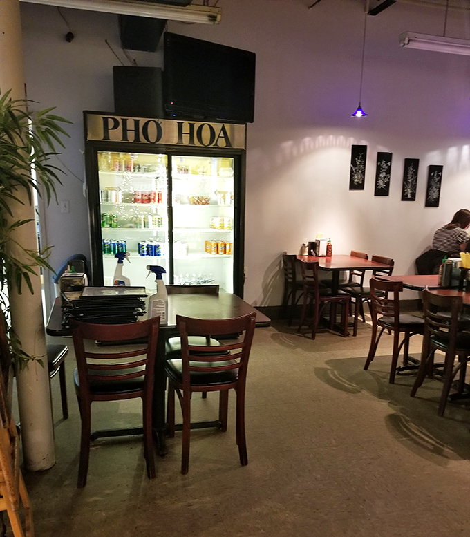 The beverage cooler glows like a beacon of refreshment, offering the perfect accompaniment to dishes that might occasionally set your taste buds ablaze.