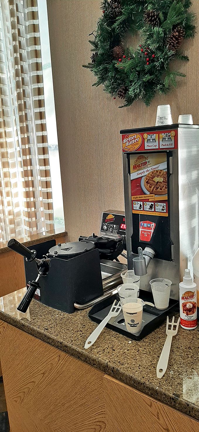 The waffle station stands ready for action, like a breakfast battle station prepared to launch deliciousness at a moment's notice.