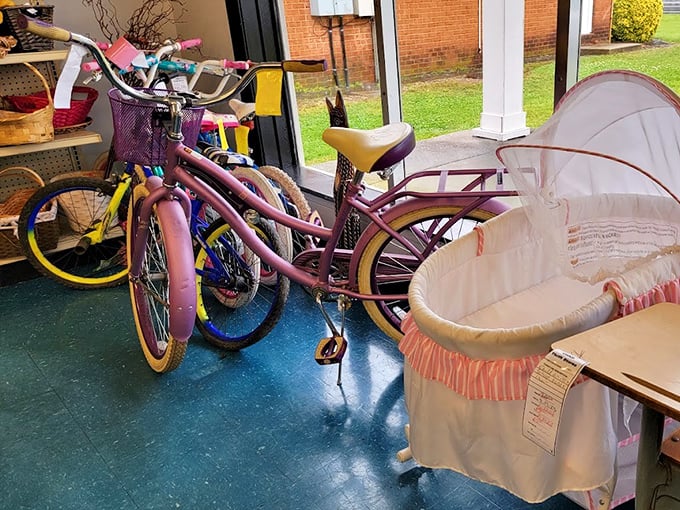 Childhood dreams on wheels next to a bassinet that's rocked generations of babies. The circle of life continues with hand-me-downs that create new memories.
