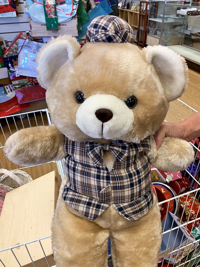 A teddy bear dressed better than most people at wine tastings, proving style comes in all sizes.