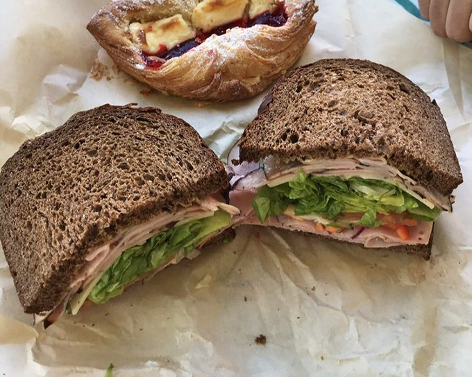 A sandwich so perfectly constructed it deserves architectural recognition&mdash;layers of ham, cheese, and veggies creating the skyscraper of lunch options.
