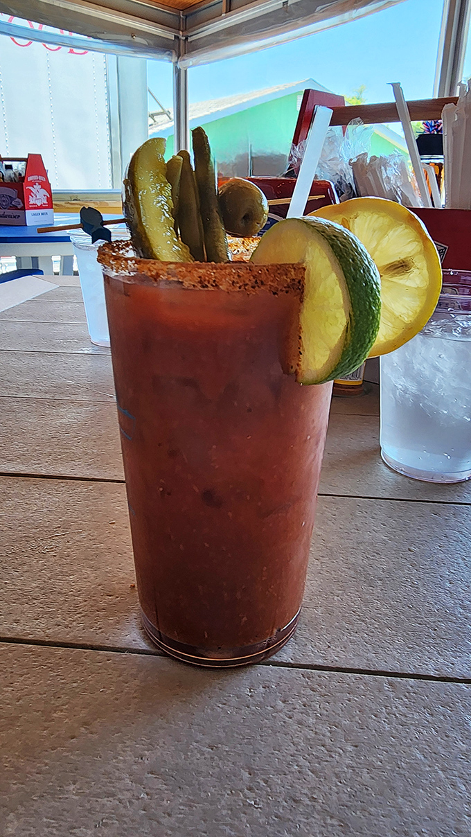 This Bloody Mary comes garnished with enough pickles and olives to qualify as both beverage and appetizer—efficient drinking at its coastal finest.