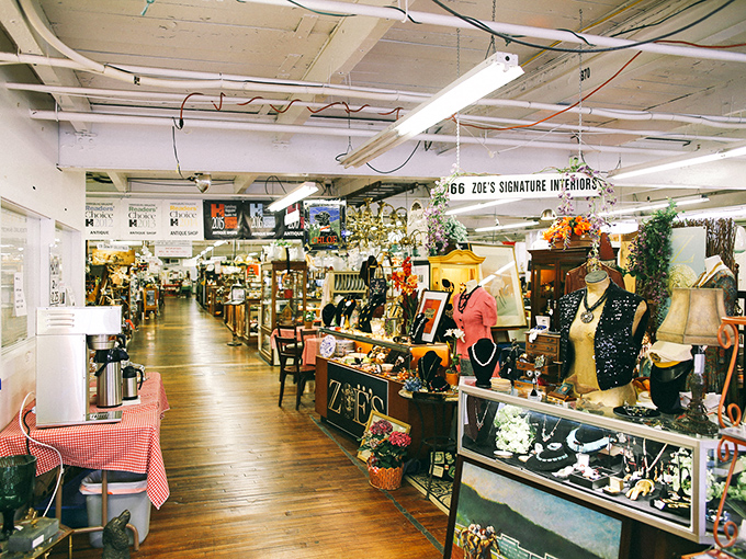 Zoe's booth showcases the marketplace's diversity – from elegant lighting to vintage fashion. The wooden floors have carried countless treasures to new homes.