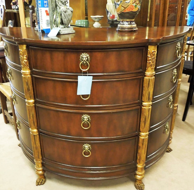 This bow-front dresser with lion-head pulls isn't just furniture&mdash;it's aristocracy for your bedroom at commoner prices.