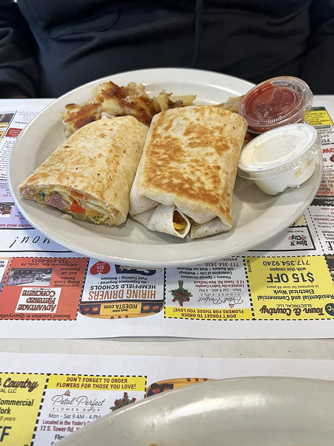 Breakfast burritos: proof that good things come in flour tortilla packages. Grilled to perfection and served with home fries for double carb happiness.
