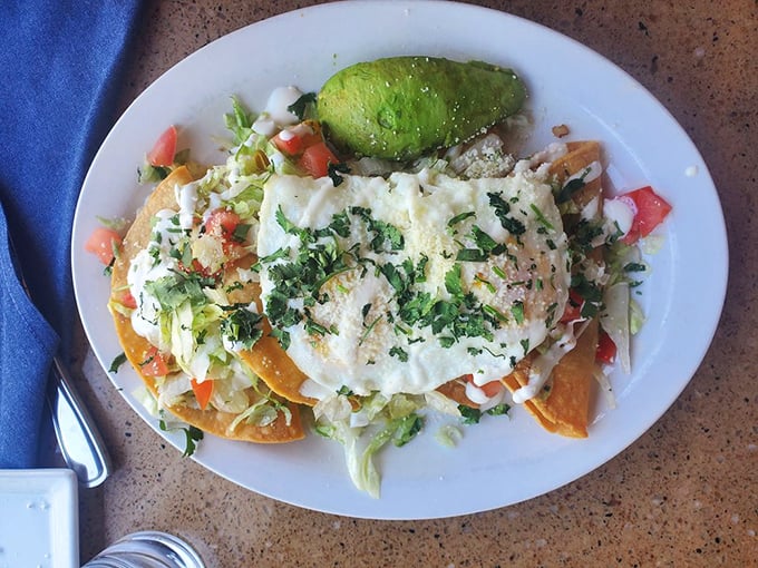 Breakfast tacos that make you question why we don't start every day this way. That avocado slice is the perfect finishing touch.