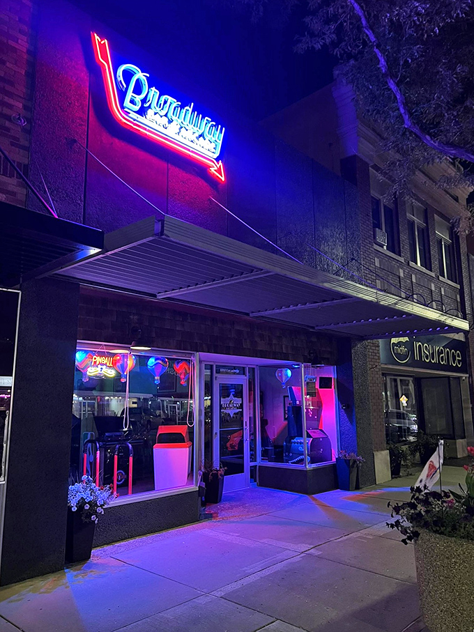 Broadway Bar and Arcade lights up Scottsbluff nights with neon nostalgia, offering entertainment that costs less than a single round at a big-city establishment.