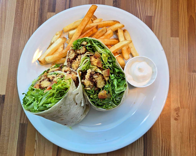 Wrapped like a present and cut to reveal its treasures, this plant-powered wrap with crisp fries makes lunch feel like a celebration.