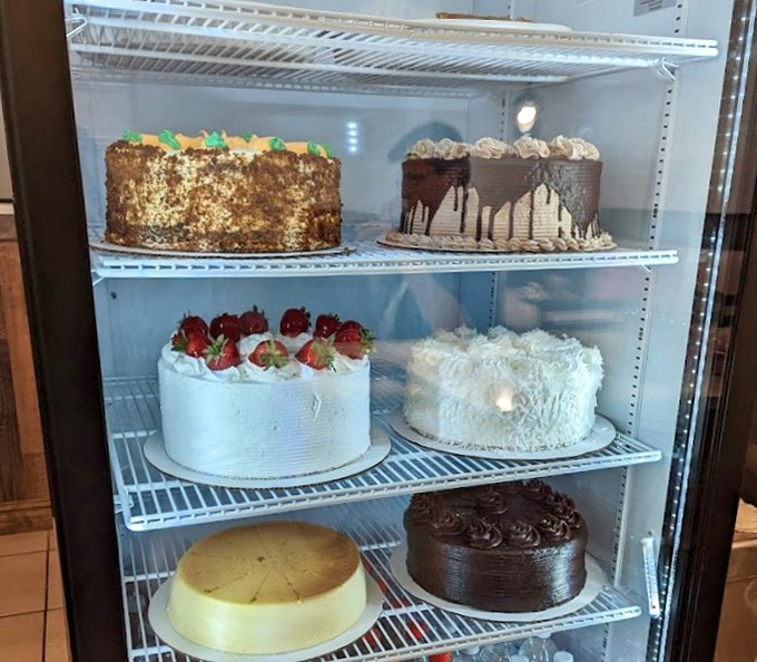 The dessert case stands as a temple of temptation&mdash;layer cakes and cream pies silently arguing that there's always room for something sweet.