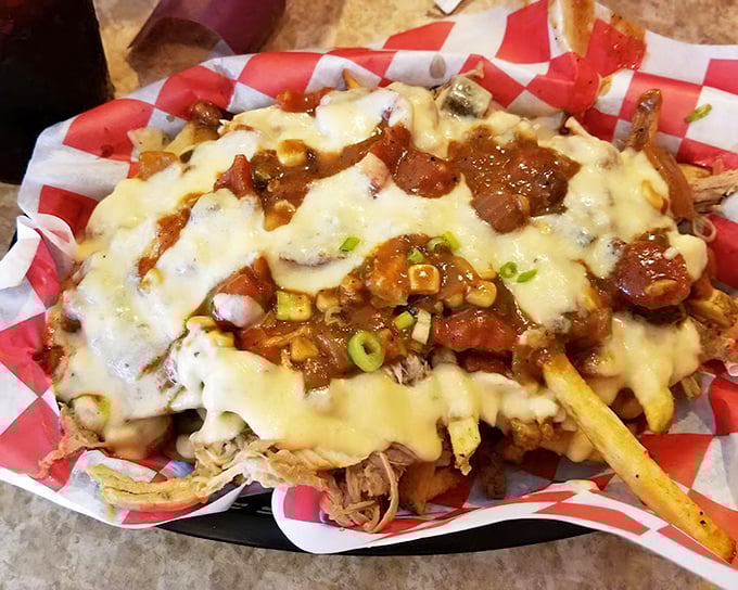 Cheese-smothered pulled pork fries&mdash;because sometimes your food deserves to wear a warm, gooey blanket.