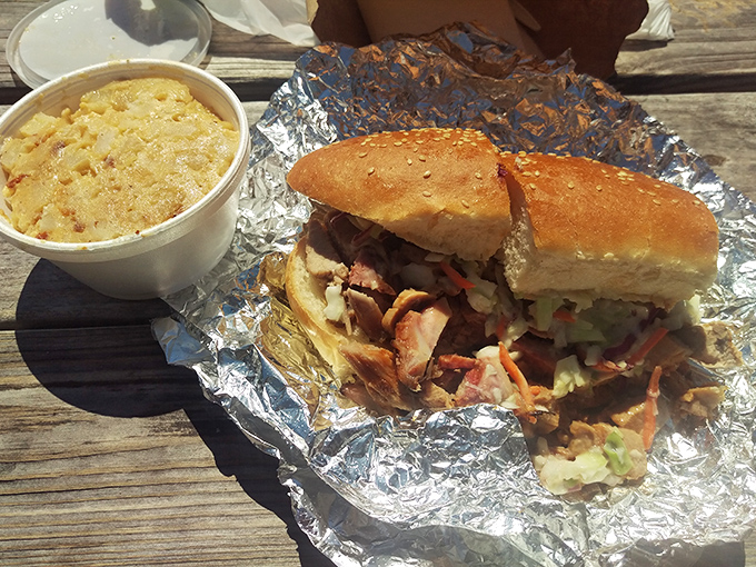 The Carolina Chopped Pork sandwich with slaw brings Southern charm to Ohio, with mac and cheese as its faithful companion.