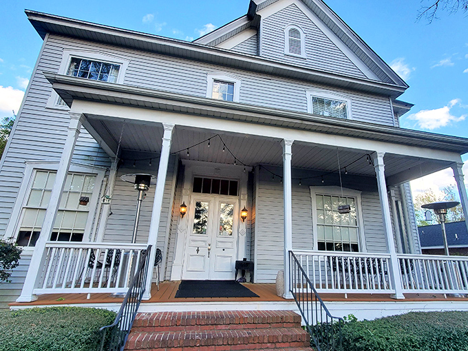 Casa Bella's welcoming porch practically whispers "come sit a spell" &ndash; the architectural equivalent of a warm Southern greeting.