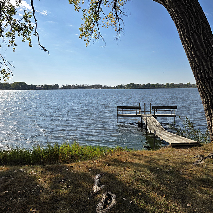 A simple dock extends an invitation to Lake Okabena's refreshing waters, promising summer memories that will warm even the coldest Minnesota winter.