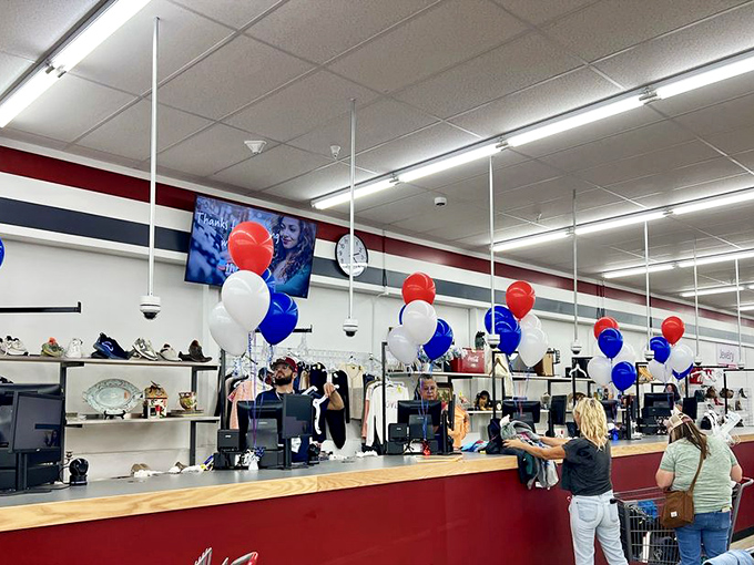 The checkout area, festooned with patriotic balloons, where treasures officially transition from "someone else's stuff" to "your amazing find."