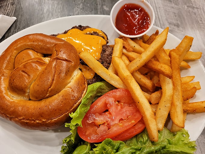 This isn't just a cheeseburger &ndash; it's a masterpiece of beef, cheese, and pretzel bun architecture that demands to be photographed before eaten.