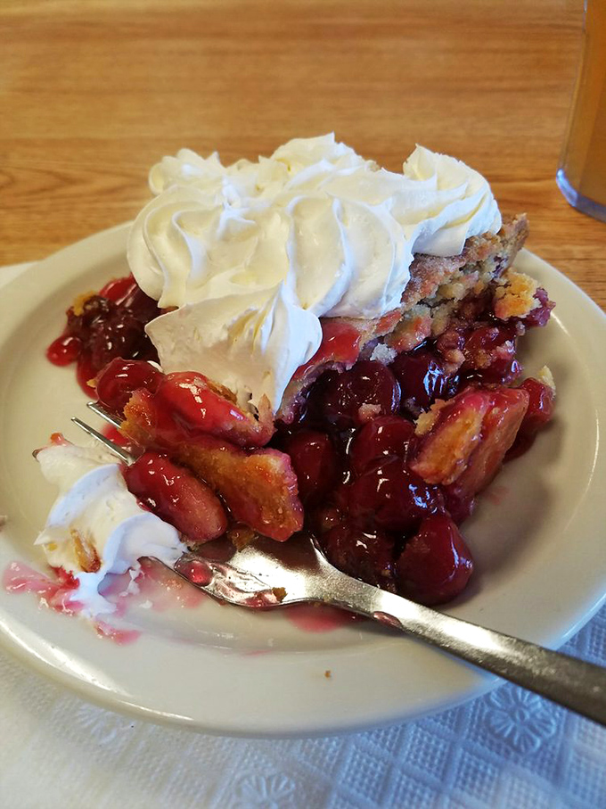 Cherry pie with a dollop of whipped cream&mdash;the sweet-tart filling peeking through the crust like a ruby treasure.