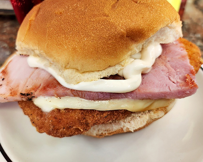 This sandwich layers ham, chicken, and melted cheese in such perfect harmony that musical composers would be jealous.