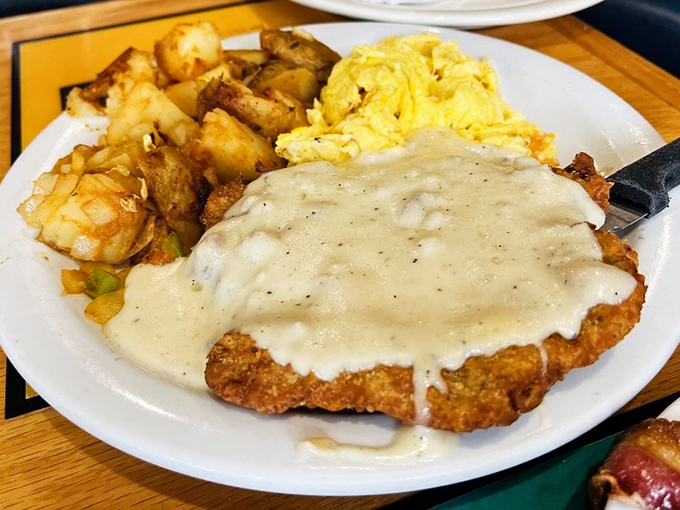 Chicken fried steak smothered in gravy that would make your cardiologist wince but your soul sing. Worth every delicious calorie.