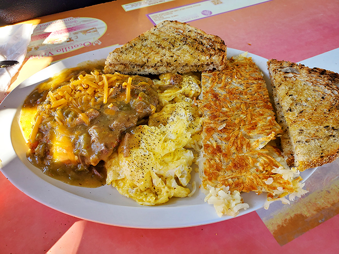 This isn't just breakfast&mdash;it's edible architecture. Eggs, hash browns, and gravy-smothered goodness creating the Taj Mahal of morning meals.