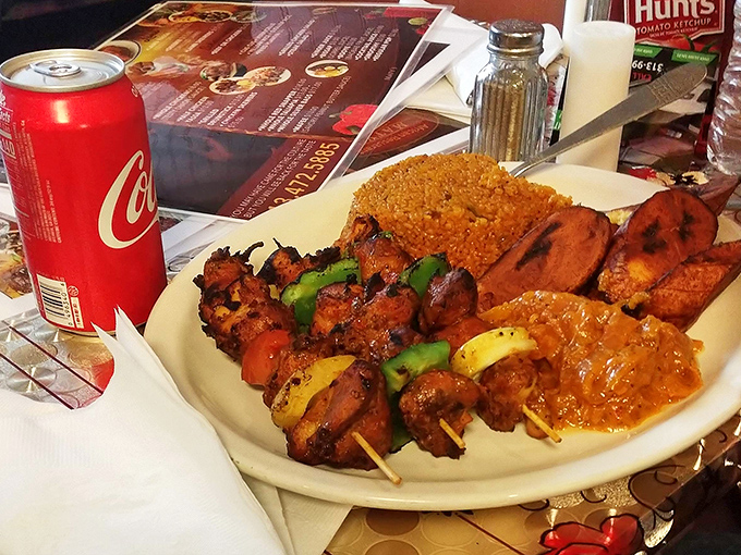 Chicken skewers with jollof rice and that incredible onion sauce prove that simple ingredients plus skill equals pure magic.
