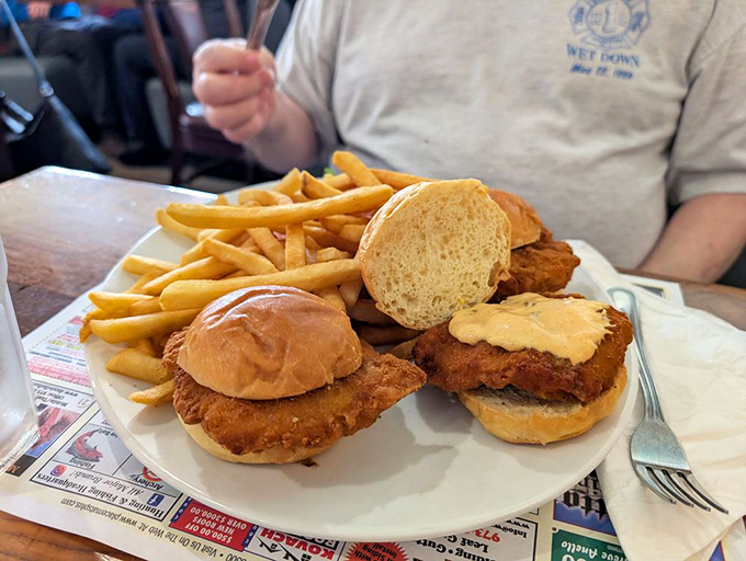 Crispy chicken sliders that deliver the perfect ratio of crunch to tenderness. The kind of hand-held happiness that makes you wonder why you'd ever order anything else.