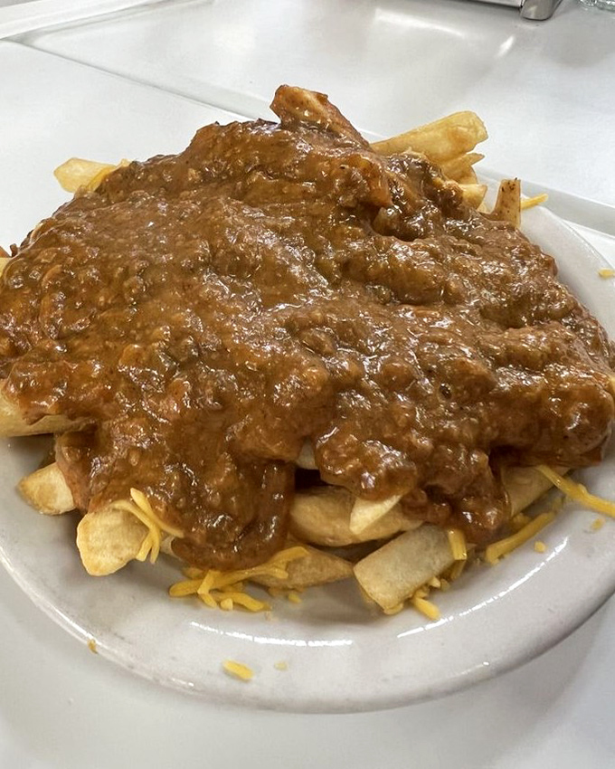 Chili cheese fries that require both a fork and a moment of silent appreciation. Diet plans come here to die gloriously.