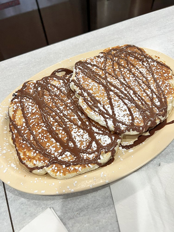 Chocolate chip pancakes drizzled with chocolate sauce&mdash;because sometimes breakfast should feel like you're getting away with something naughty.