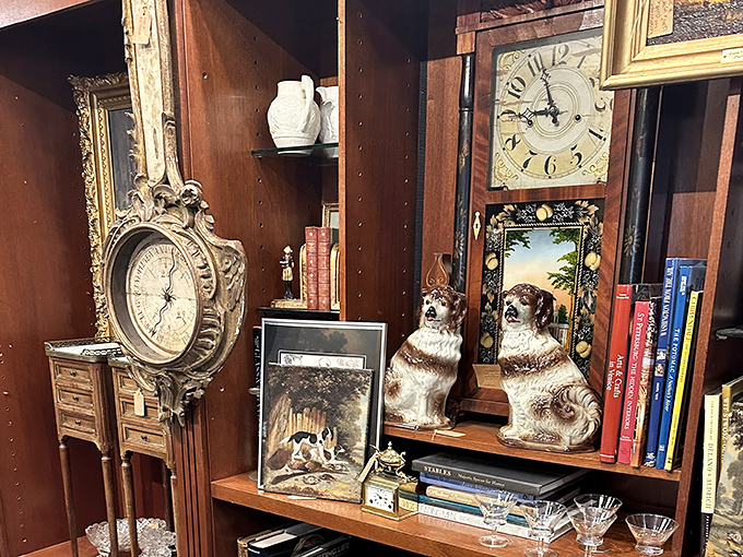 Timepieces and canine companions frozen in porcelain&mdash;because nothing says "refined collector" like ceramic dogs guarding your antique clocks.