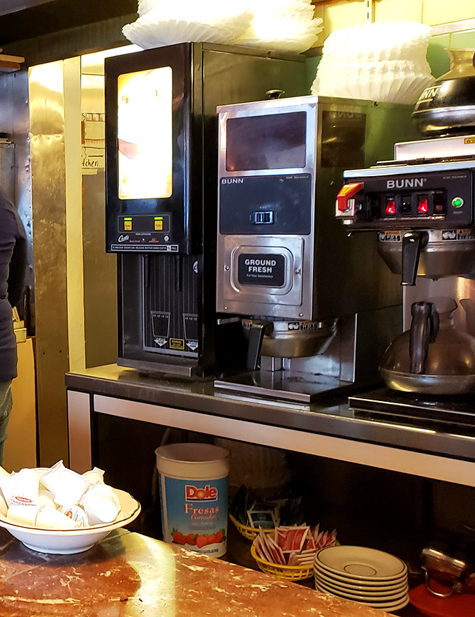 The coffee station&mdash;command central for morning revival. That "Ground Fresh" label isn't just a promise, it's the diner's sacred oath.