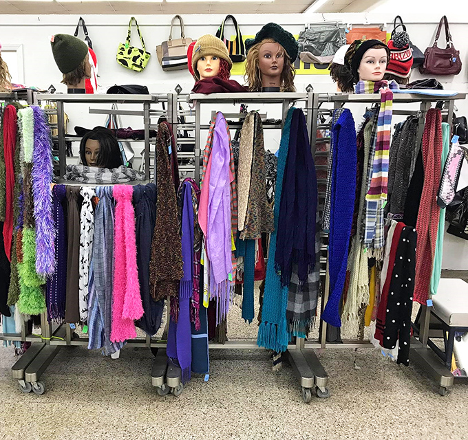 The mannequin heads silently judging your scarf selections while offering the finest in second-hand accessories and winter warmth.