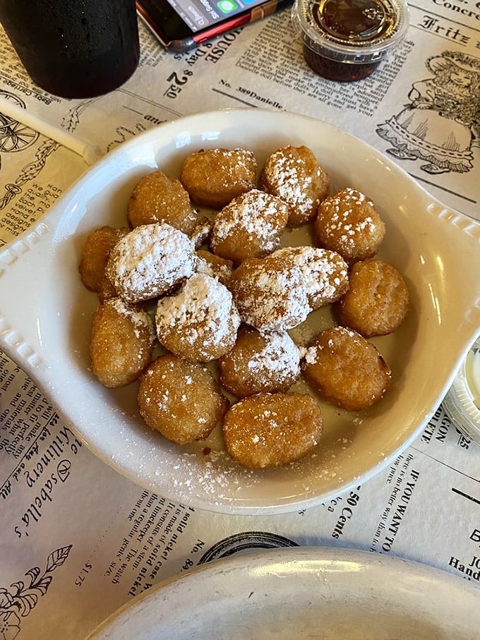These corn fritters aren't just fried dough &ndash; they're little golden orbs of joy dusted with powdered sugar that disappear faster than you can say "more please."