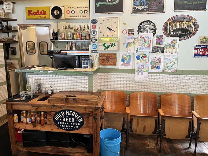 The bar area blends subway tile with mint green accents, creating a retro-fresh vibe that makes waiting for your food feel like part of the experience.