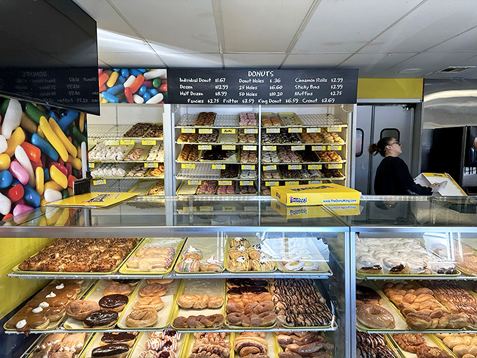 Donut varieties stretch as far as the eye can see, creating the adult version of a candy store where decision paralysis is a delicious problem.