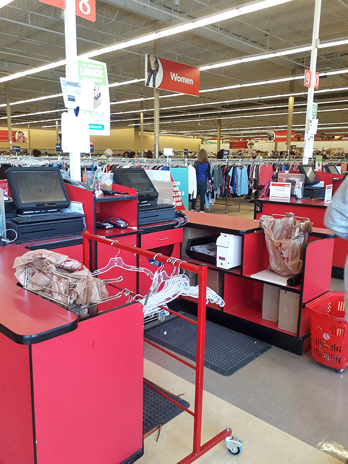 Where thrifting dreams meet checkout reality. The red counters have witnessed countless treasure hunters' victorious final moments.