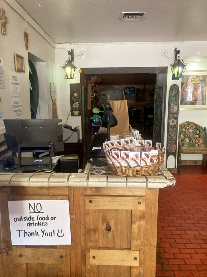 The humble host stand guards the entrance to flavor country, with menus standing by like eager tour guides.