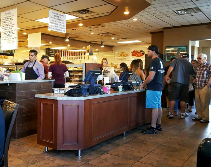 At the counter, efficient staff orchestrate the breakfast ballet, turning orders into plates of deliciousness with practiced precision.