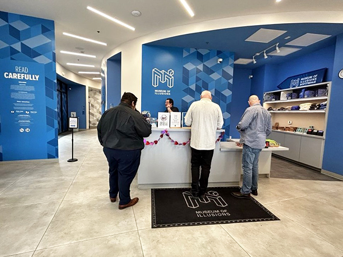 The welcoming lobby where your journey into perceptual puzzlement begins. "Read Carefully" indeed&mdash;nothing is quite as it seems here.