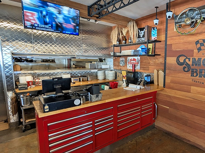 Where culinary magic happens – that red toolbox counter isn't storing wrenches, it's housing the secrets to barbecue perfection.