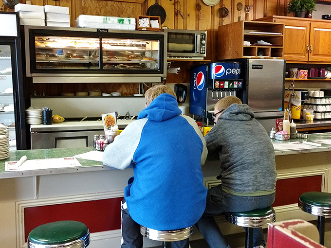The counter seats&mdash;where solo diners become regulars and regulars become family. That pie display case isn't helping anyone's diet plans.