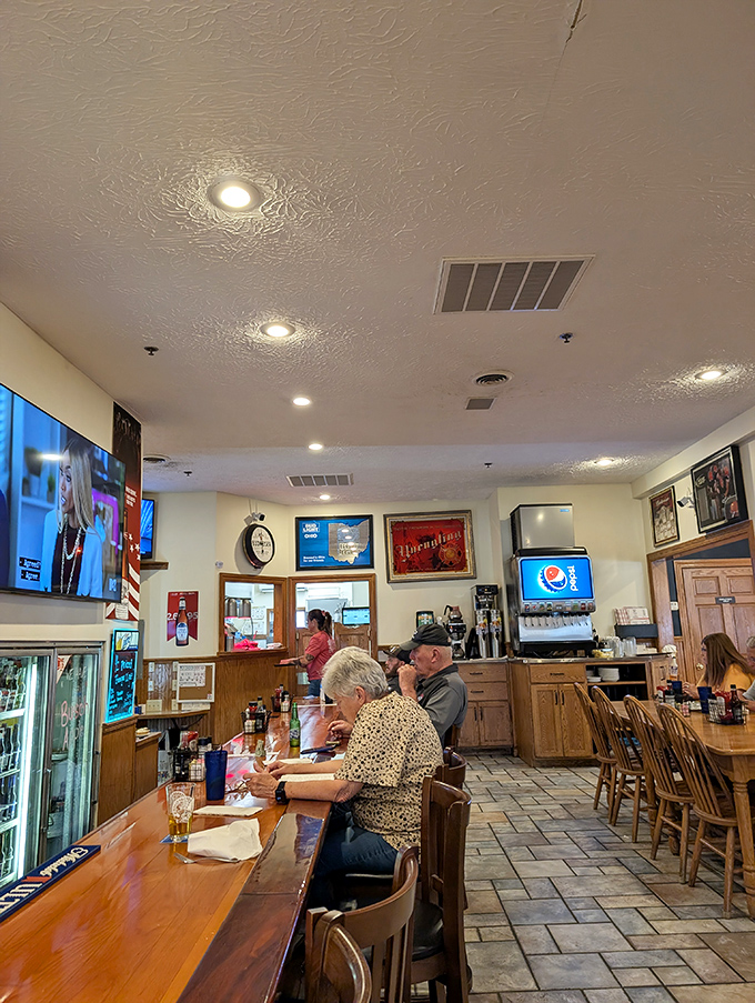 Counter seating where regulars hold court and newcomers quickly learn the unwritten rules—like which bartender makes the strongest pour.